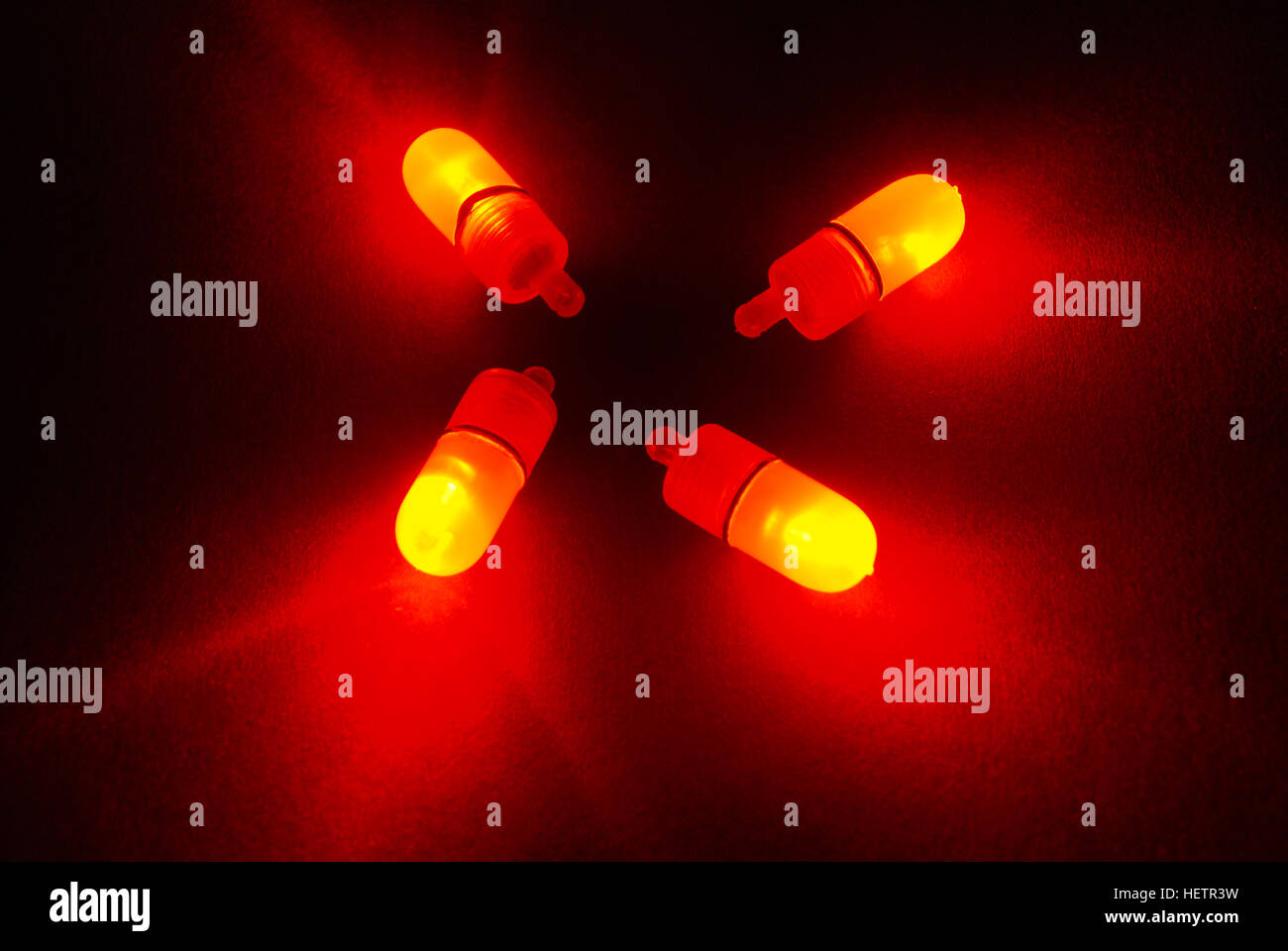Fishing four red LED power indicators isolated on black background ...