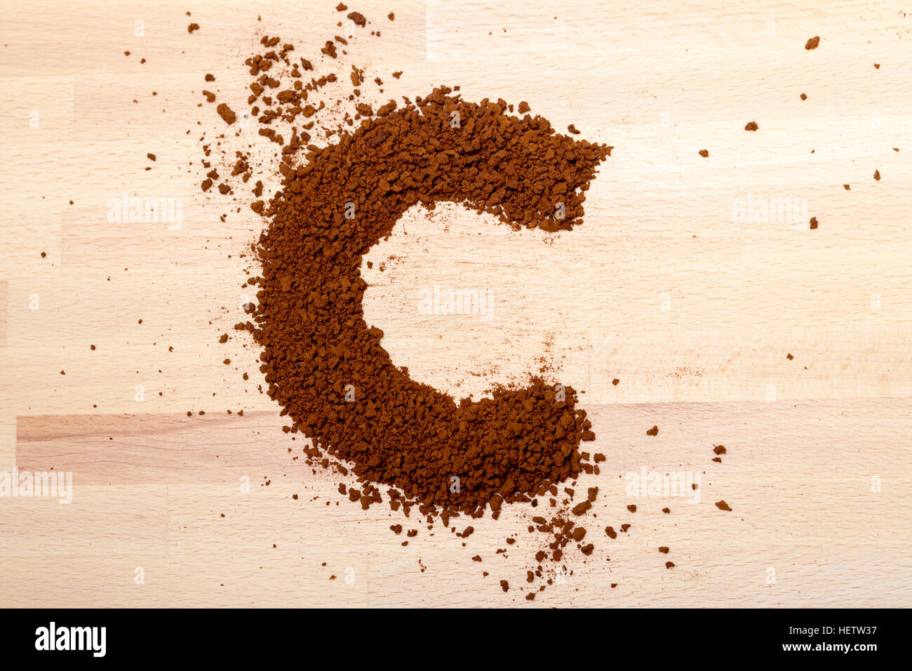 Letter C, alphabet from coffee beans. isolated on wood Stock Photo - Alamy