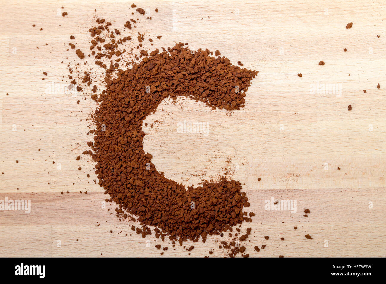 Letter C, alphabet from coffee beans. isolated on wood Stock Photo - Alamy