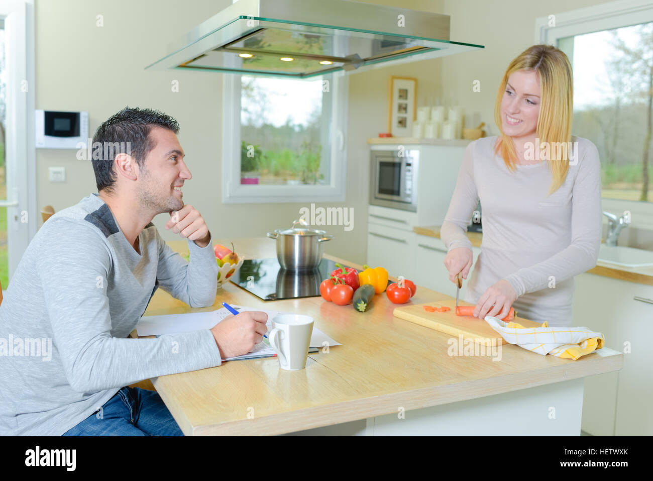 Couple in the kitchen together Stock Photo - Alamy