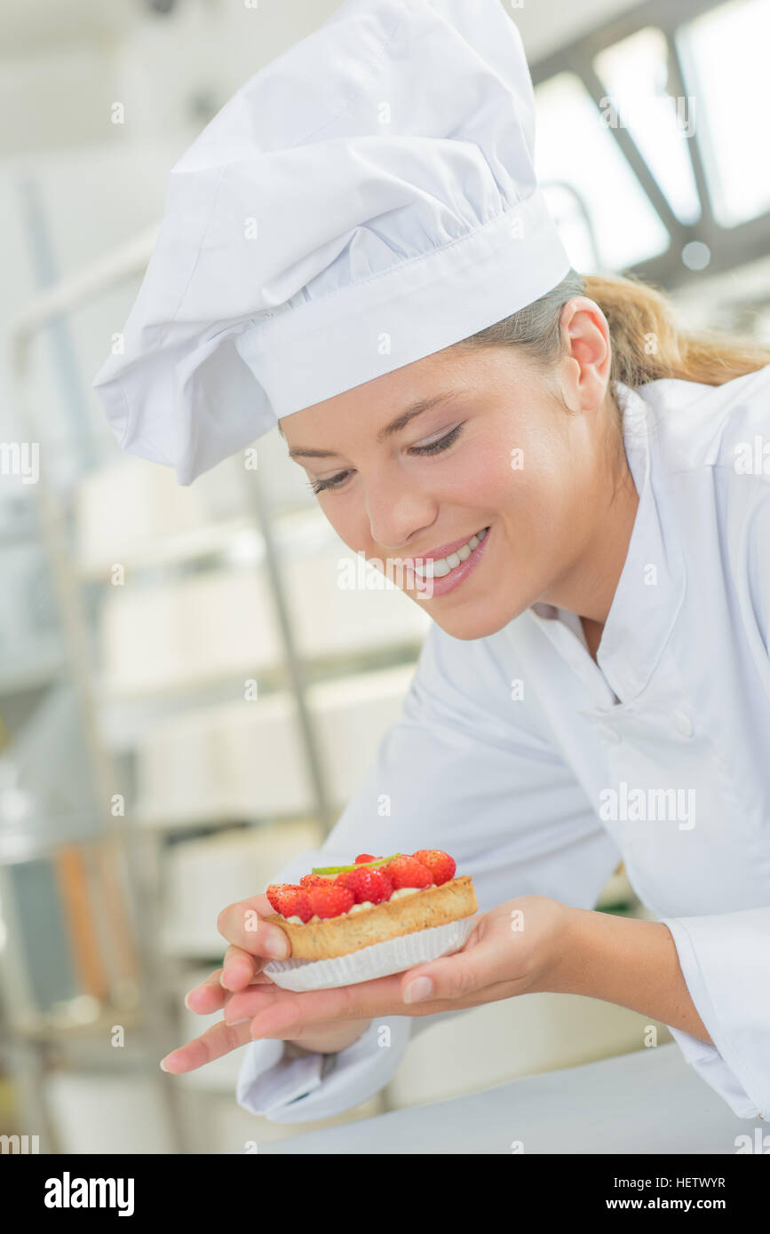 chef holding a strawberry cake Stock Photo - Alamy