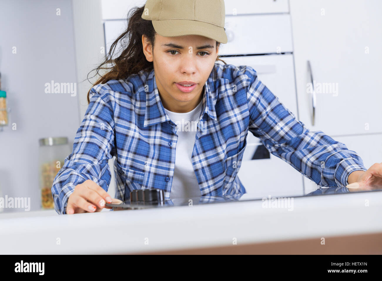 young repair man measuring kitchen cabinet Stock Photo - Alamy