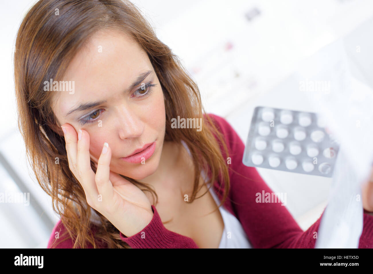Worried about taking medication Stock Photo - Alamy