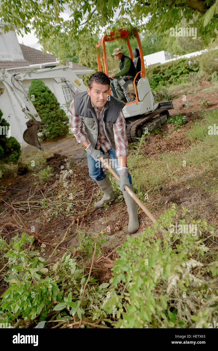 Gardener using a rake Stock Photo - Alamy