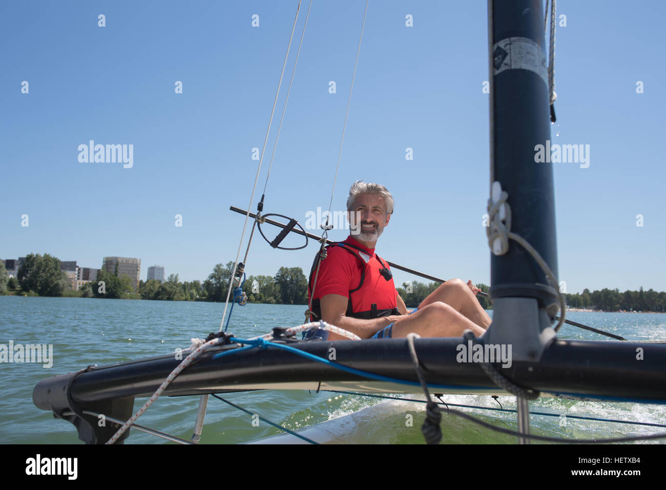 enjoying extreme sailing with racing sailboat Stock Photo - Alamy