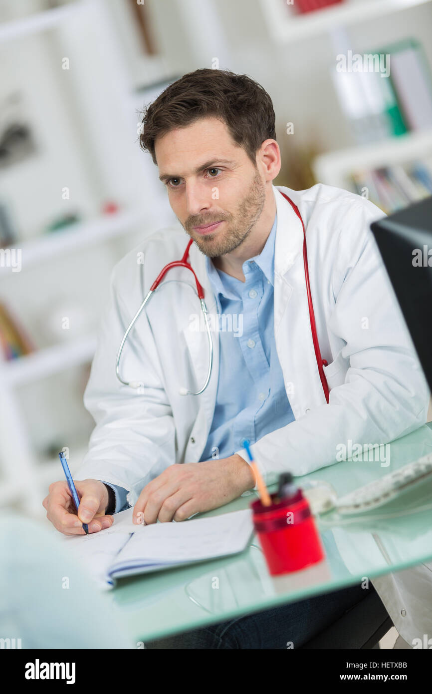 Healthcare professional taking notes hi-res stock photography and ...