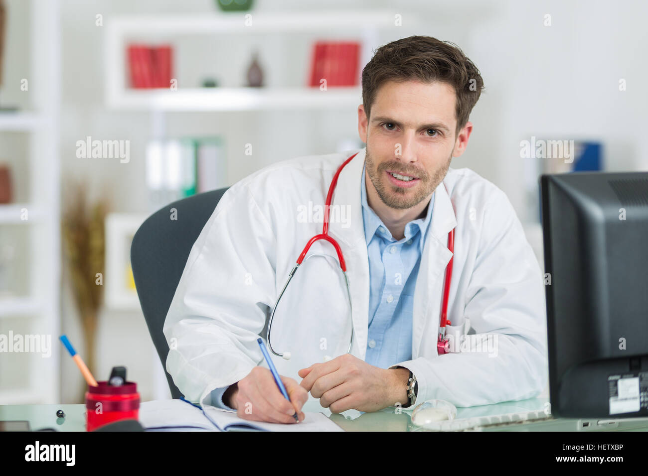 Patient doctor taking notes hi-res stock photography and images - Alamy