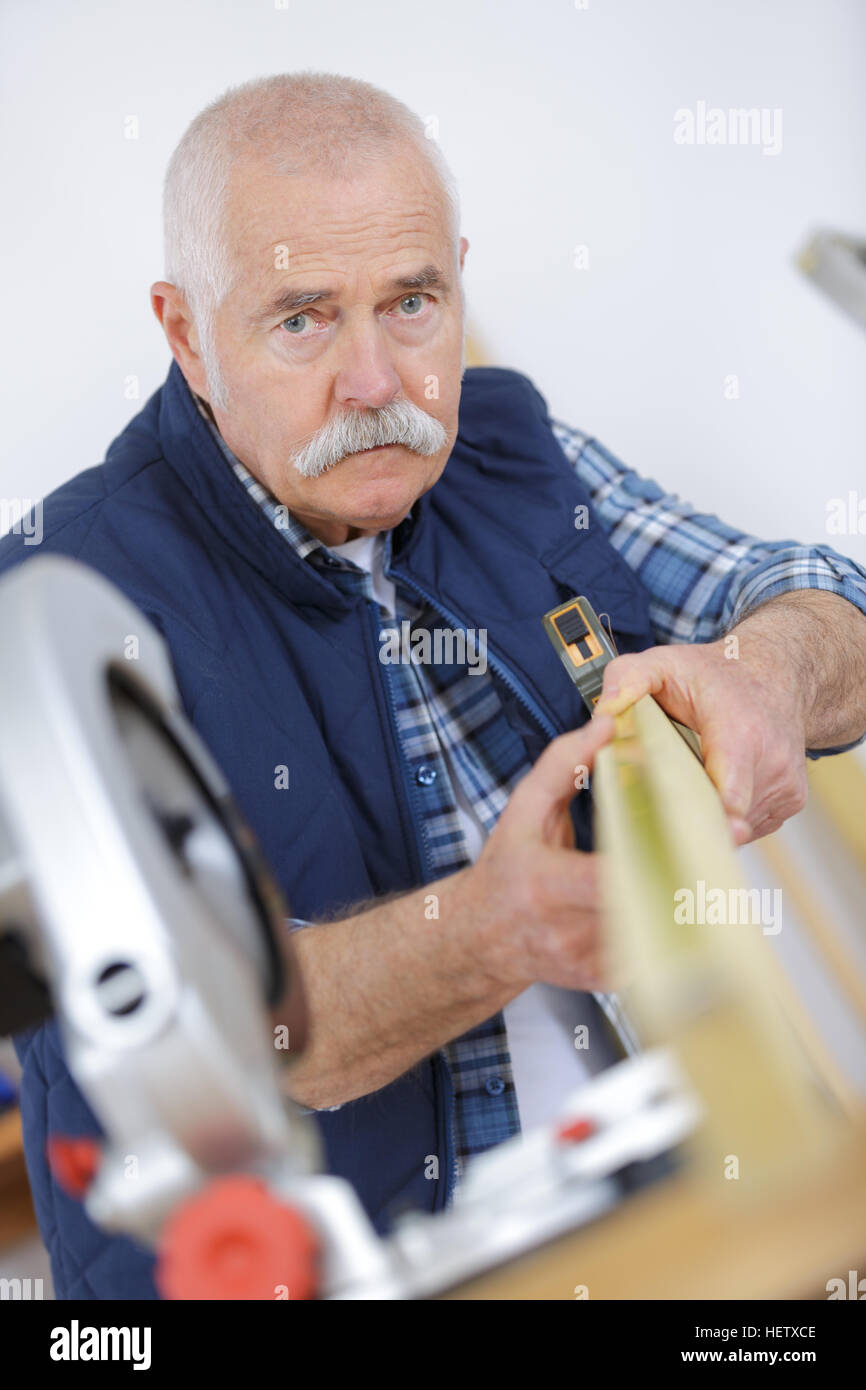 Man buying construction wood in a DIY store for his DIY home re ...