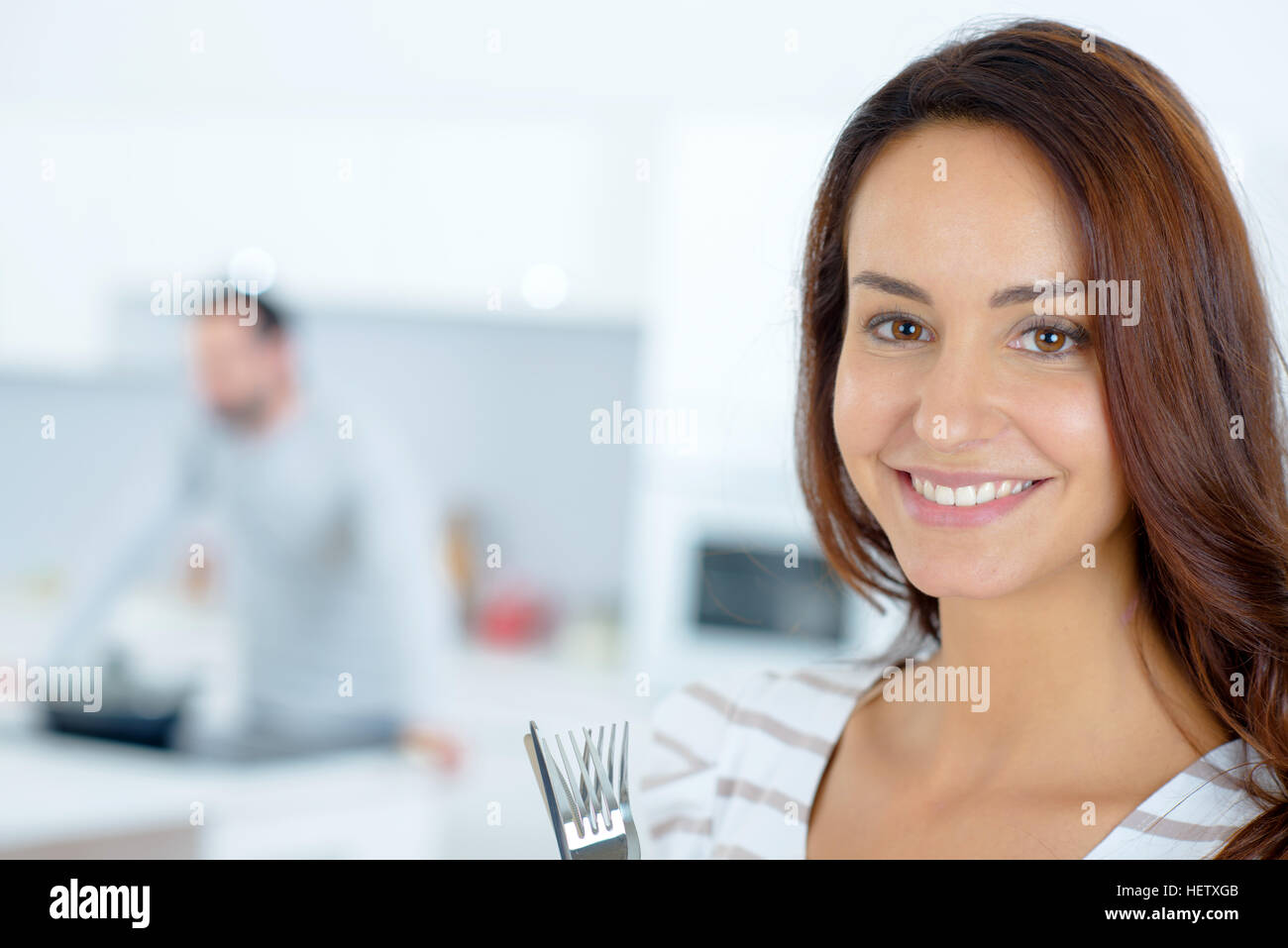 Wife letting her husband cook Stock Photo - Alamy