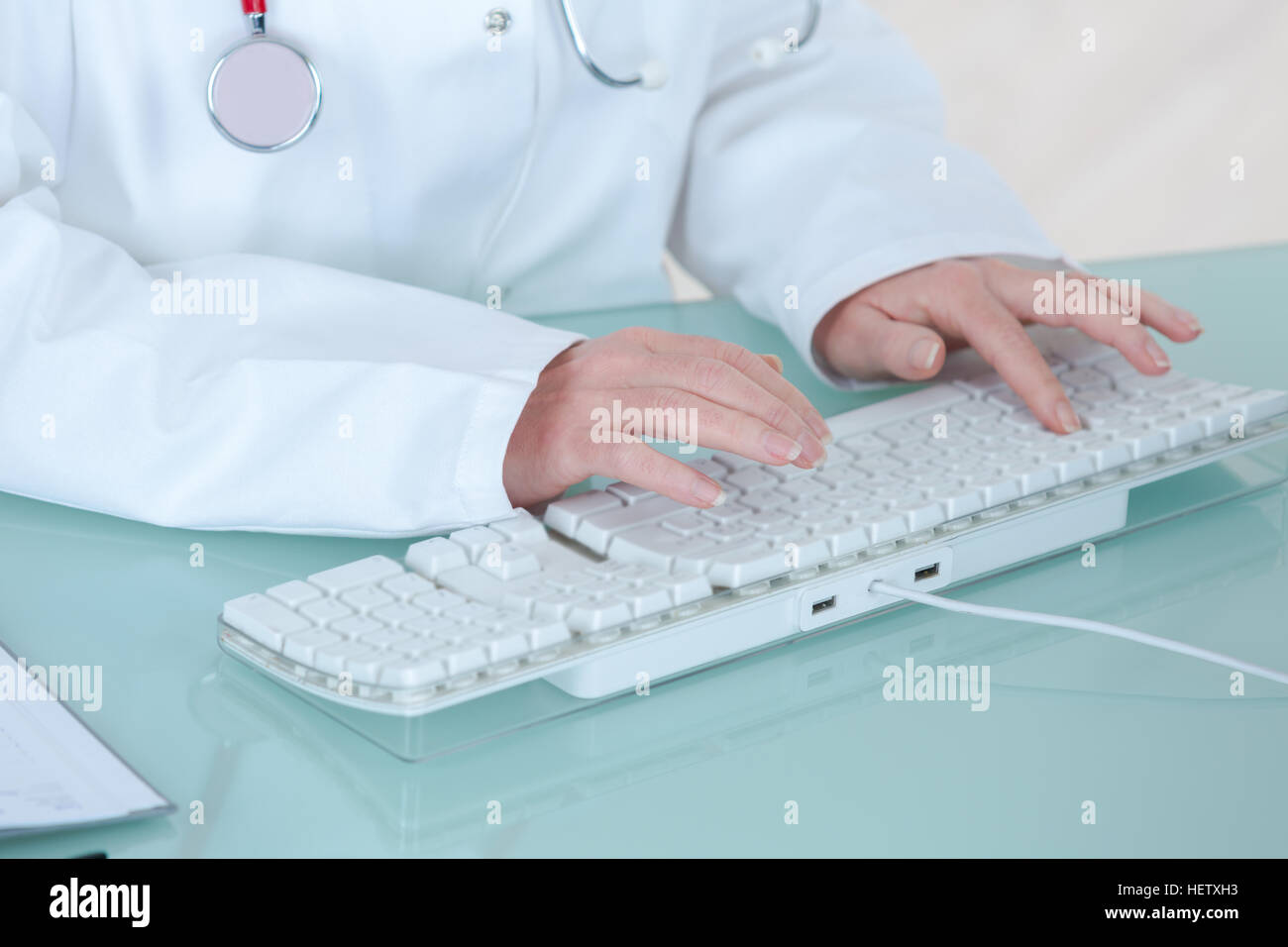 female doctor typing at laptop computer Stock Photo - Alamy
