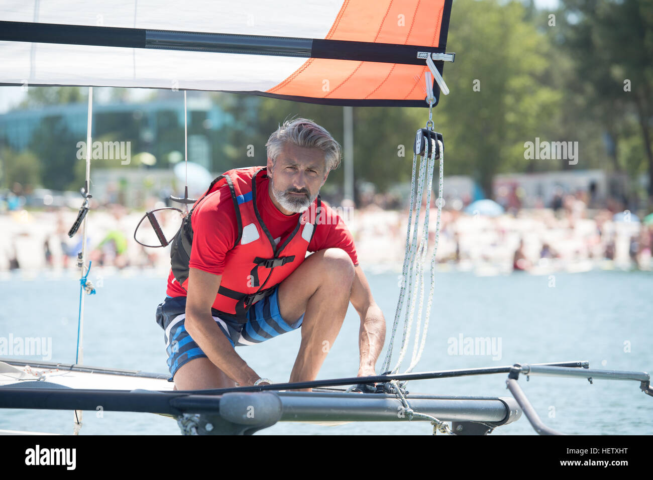 professional waterman training on lake with catamaran Stock Photo - Alamy