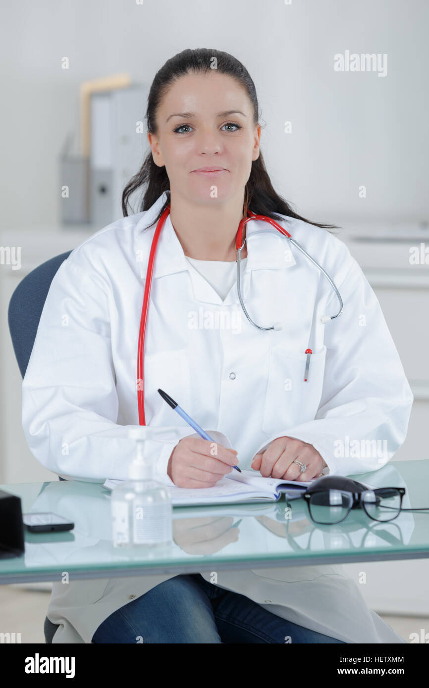 beautiful female doctor working at the office Stock Photo - Alamy