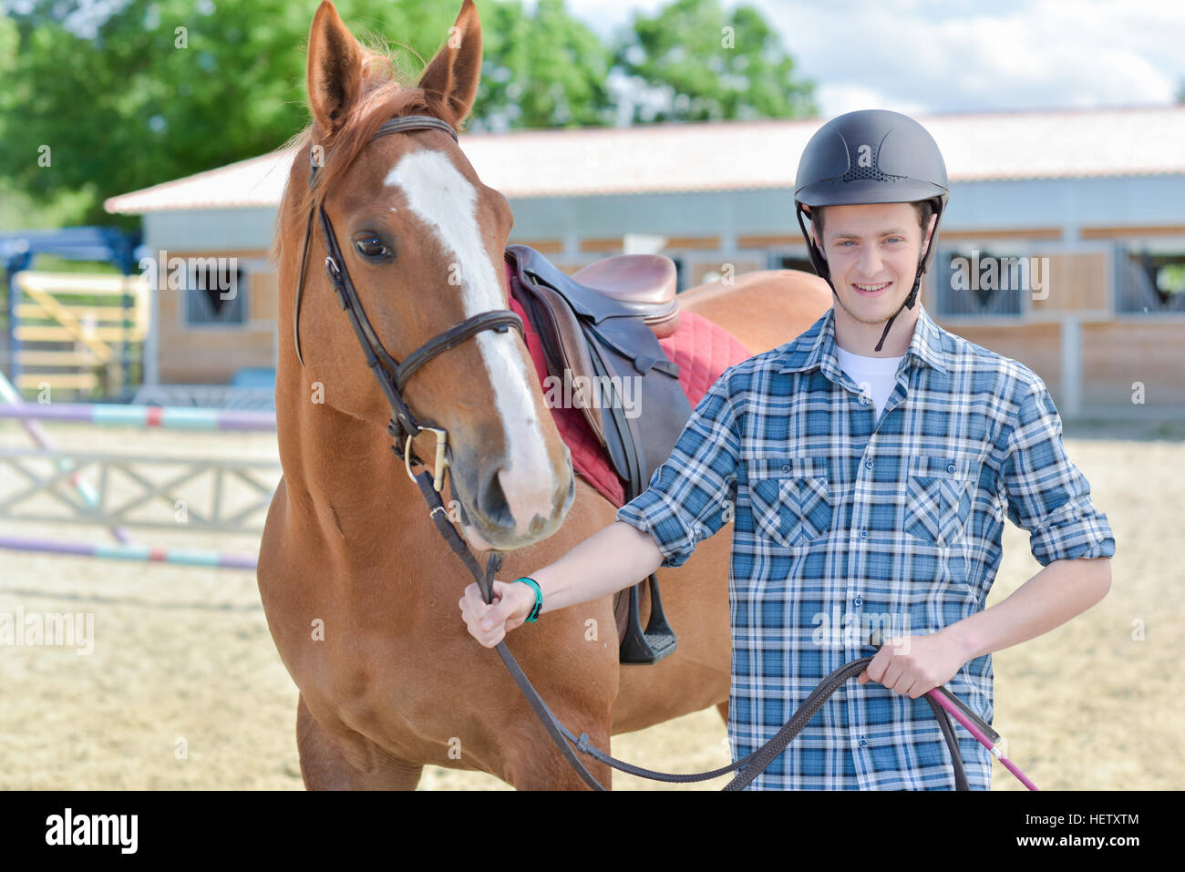 young man with a horse Stock Photo - Alamy