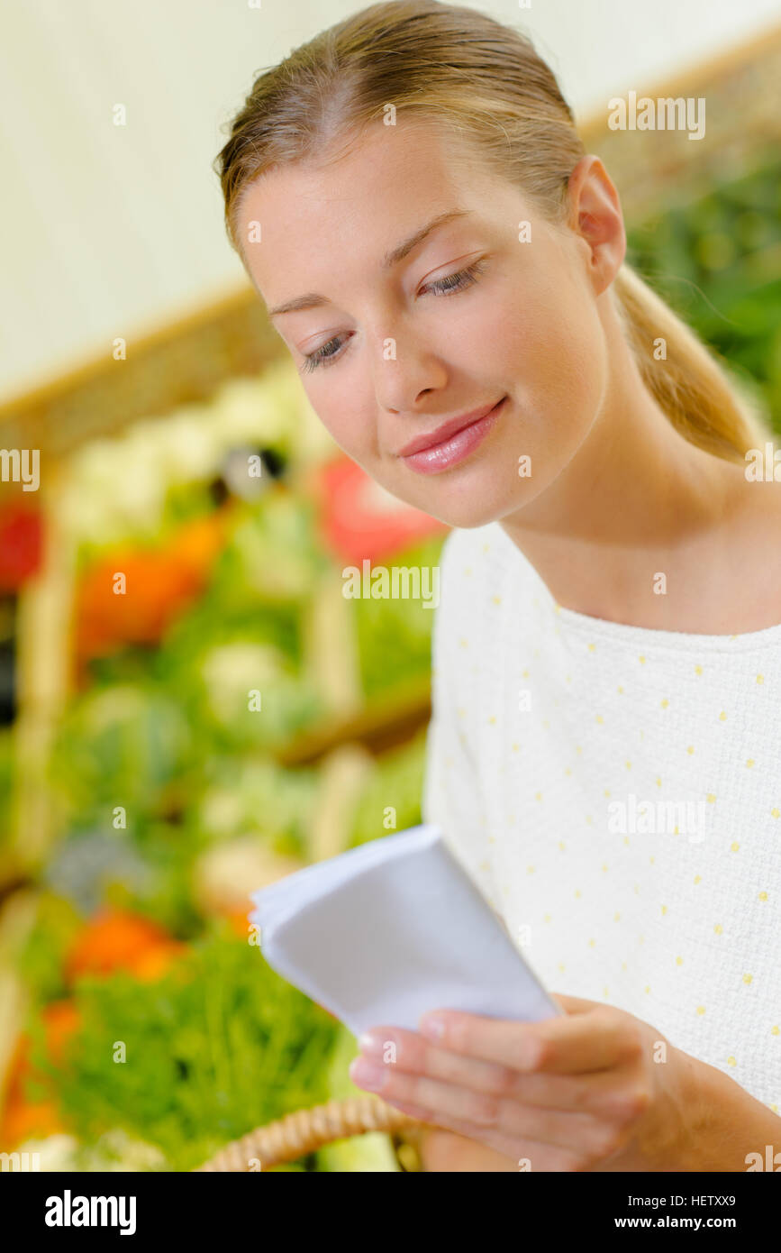 Woman reading shopping list hi-res stock photography and images - Alamy