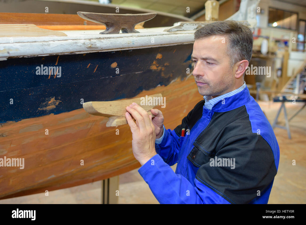worker making a boat Stock Photo - Alamy