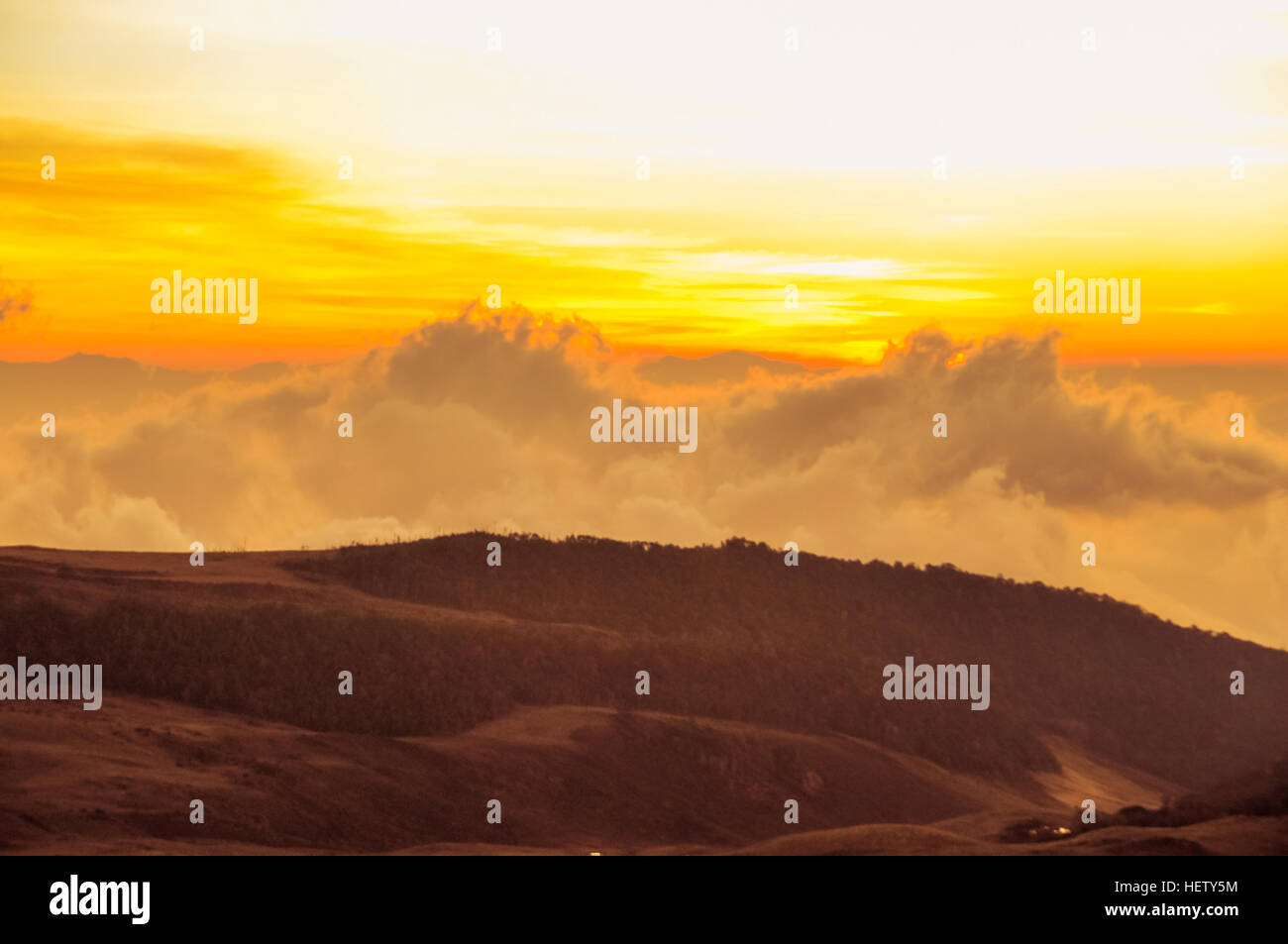 Photo of evening fog and colours of sunset on horizon near Mt. Giluwe ...