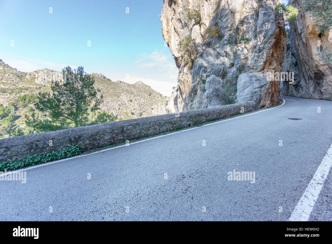 Empty road between rocks hi-res stock photography and images - Alamy