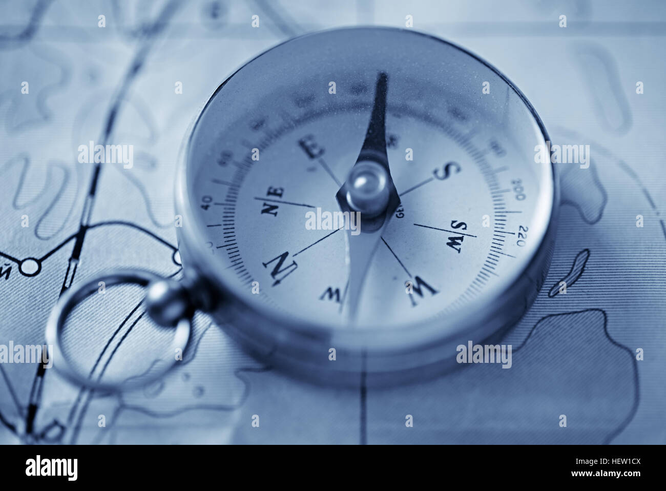 Navigation with a magnetic compass and ancient maps Stock Photo - Alamy