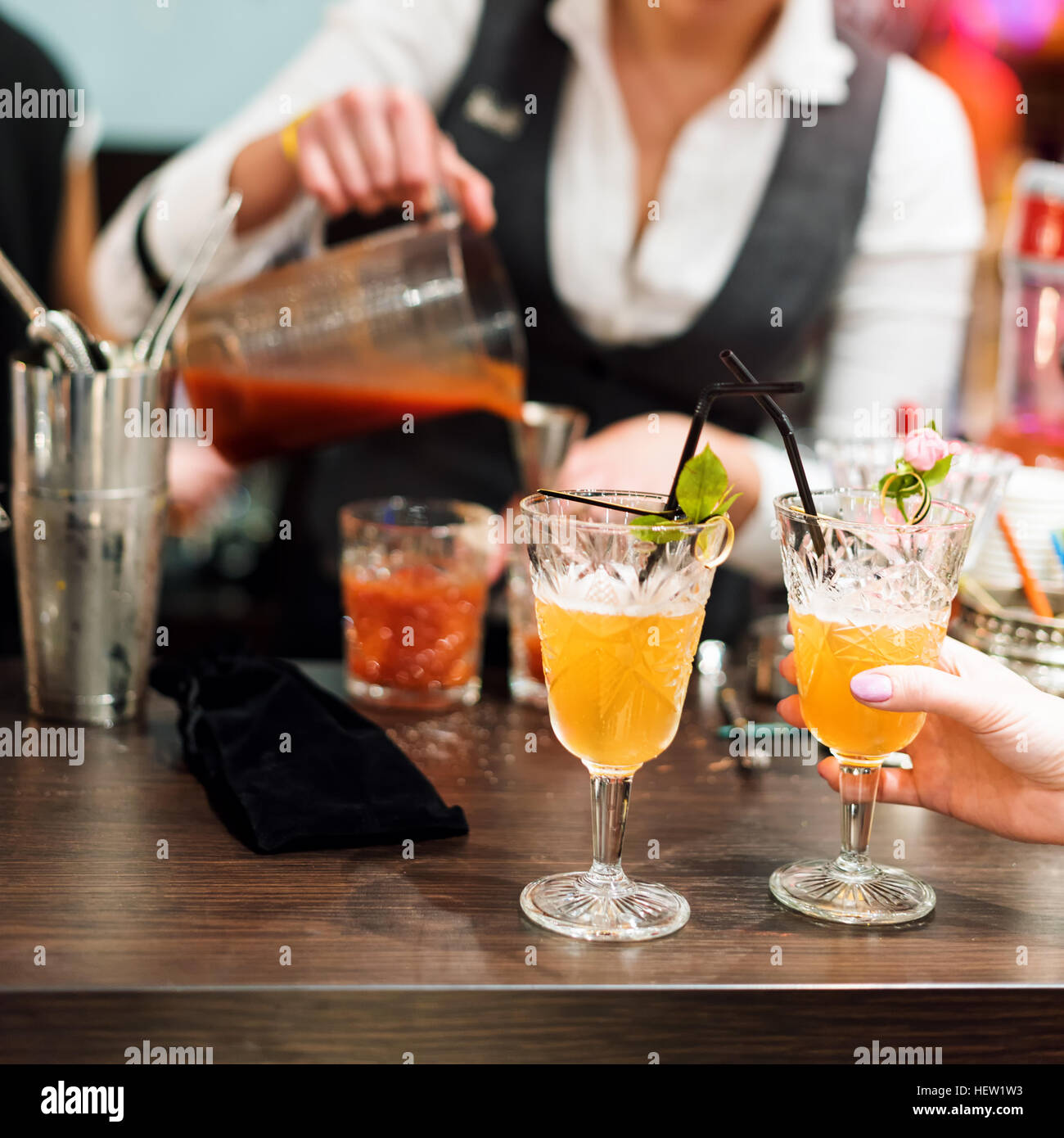 Barman show. Female bartender is making cocktail at night club Stock ...
