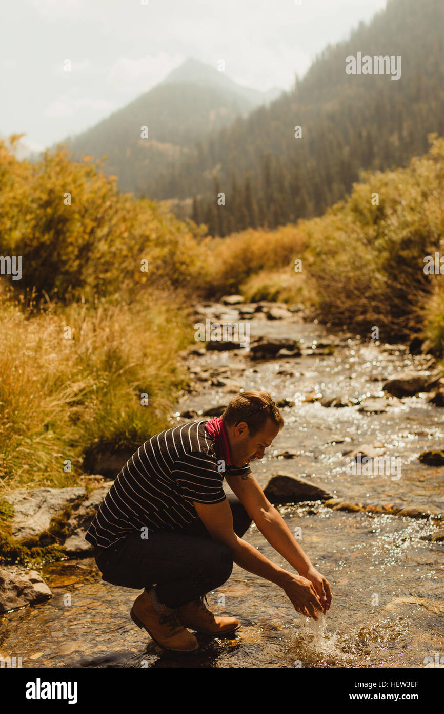 Man washing hands in creek, Mineral King, Sequoia National Park ...