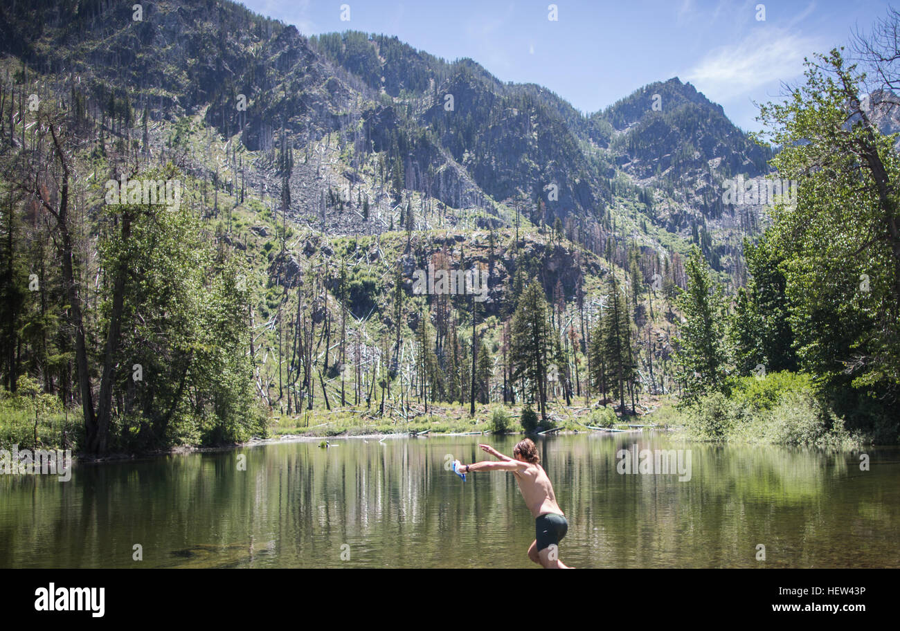 Man jumping into stream, Enchantments, Alpine Lakes Wilderness ...