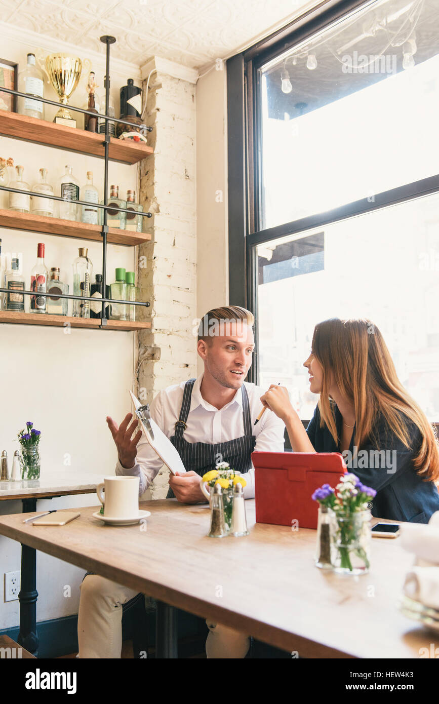 Waiter Explaining Menu High Resolution Stock Photography and Images - Alamy