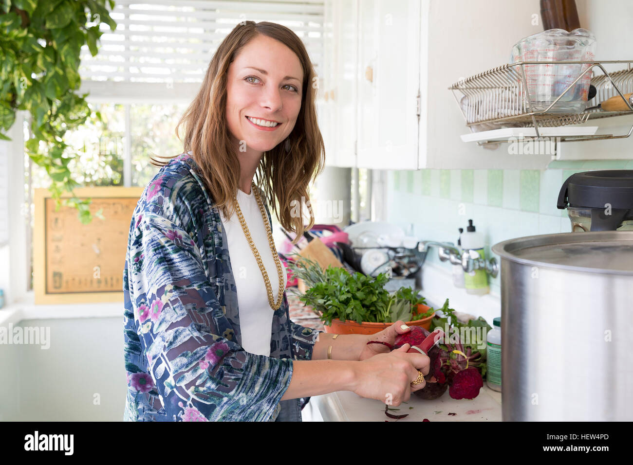 Women in kitchen preparing food Stock Photo - Alamy
