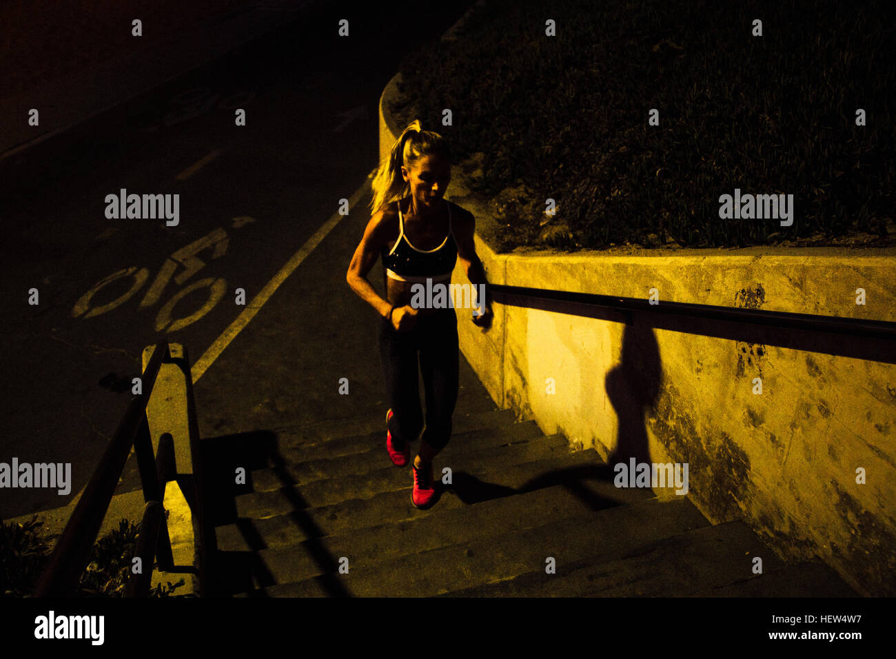Running on beach night hi-res stock photography and images - Alamy