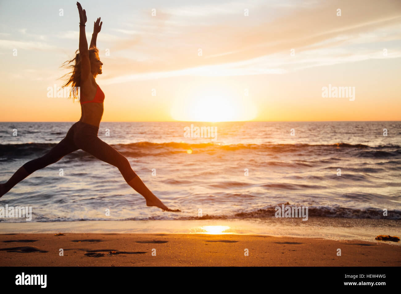 Leaping woman hi-res stock photography and images - Alamy