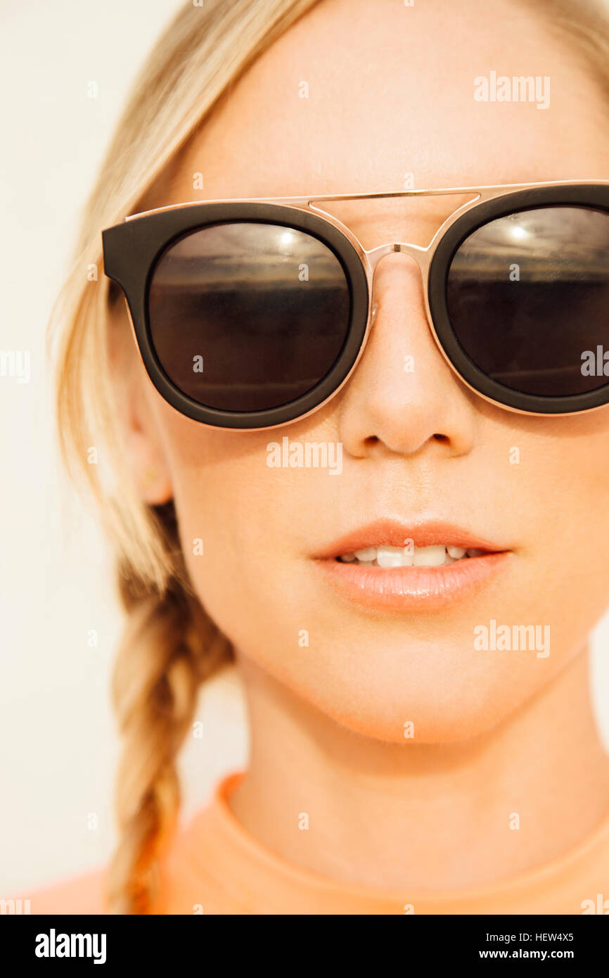 Close up portrait of woman wearing sunglasses Stock Photo - Alamy