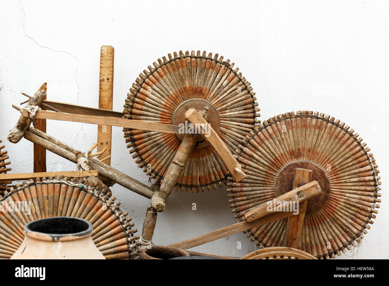 Background with a group of old and unused wooden wheels of carts and ...