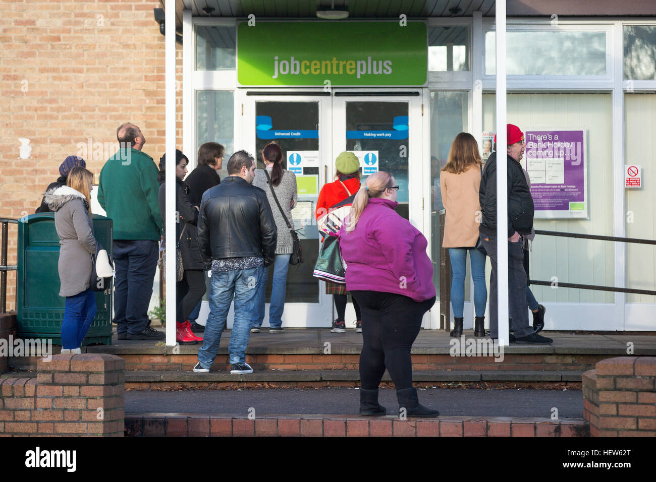 People queuing to go into the job centre in Cambridge Stock Photo - Alamy