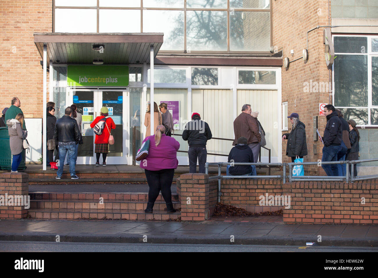 People queuing to go into the job centre in Cambridge Stock Photo - Alamy