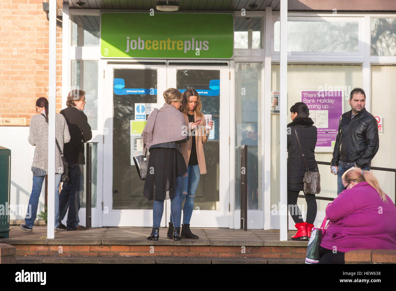 People queuing to go into the job centre in Cambridge Stock Photo - Alamy
