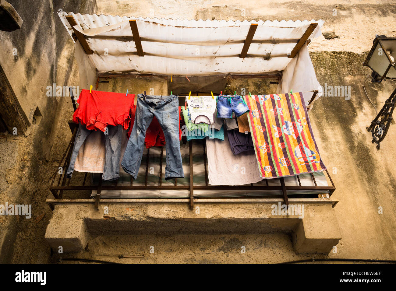 Laundry drying on a balcony in Sicily Stock Photo - Alamy