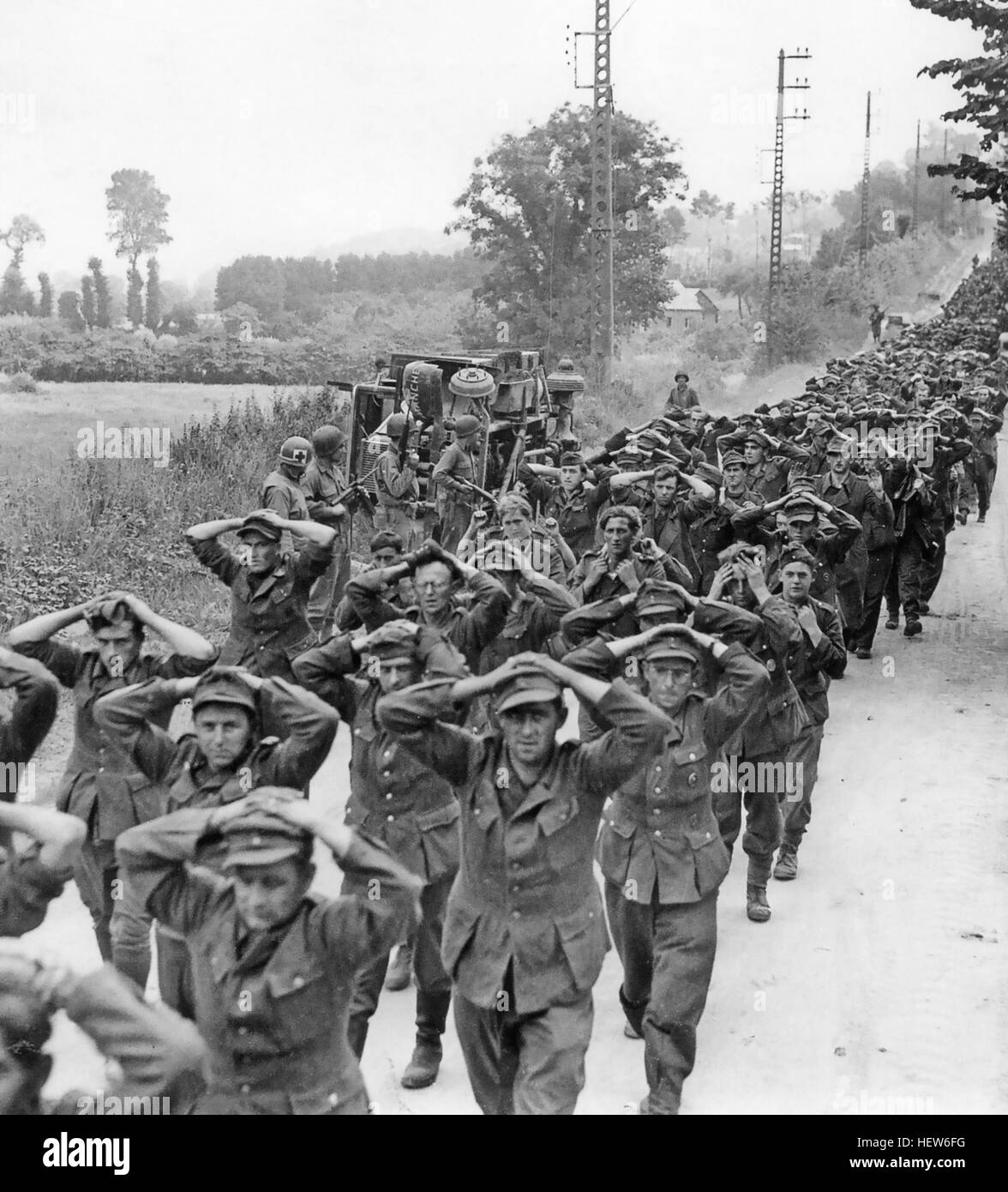 LIBERATION OF AVRANCHES. German prisoners are marched off after the ...