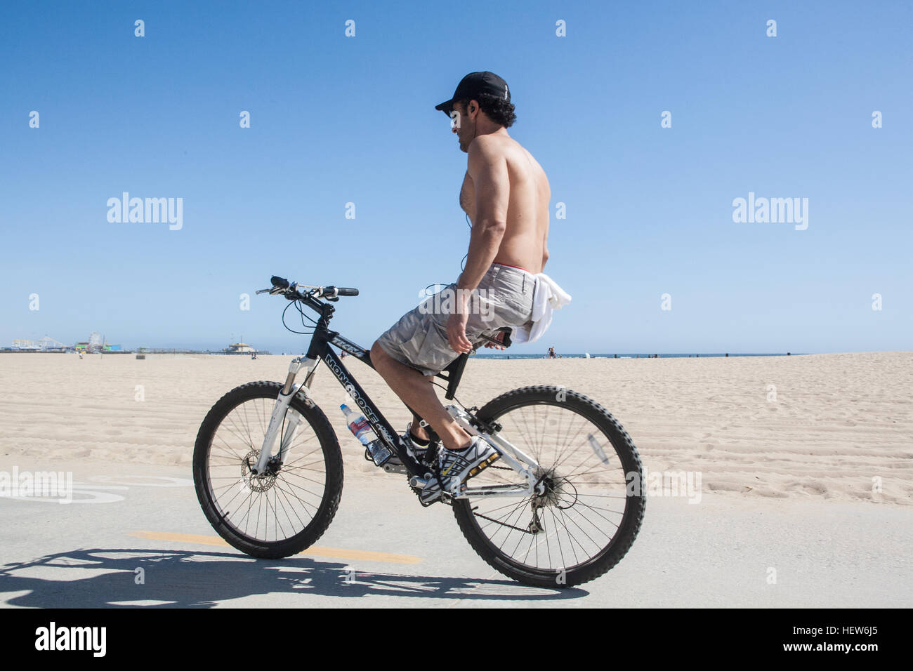 Man riding bike along ocean hi-res stock photography and images - Alamy