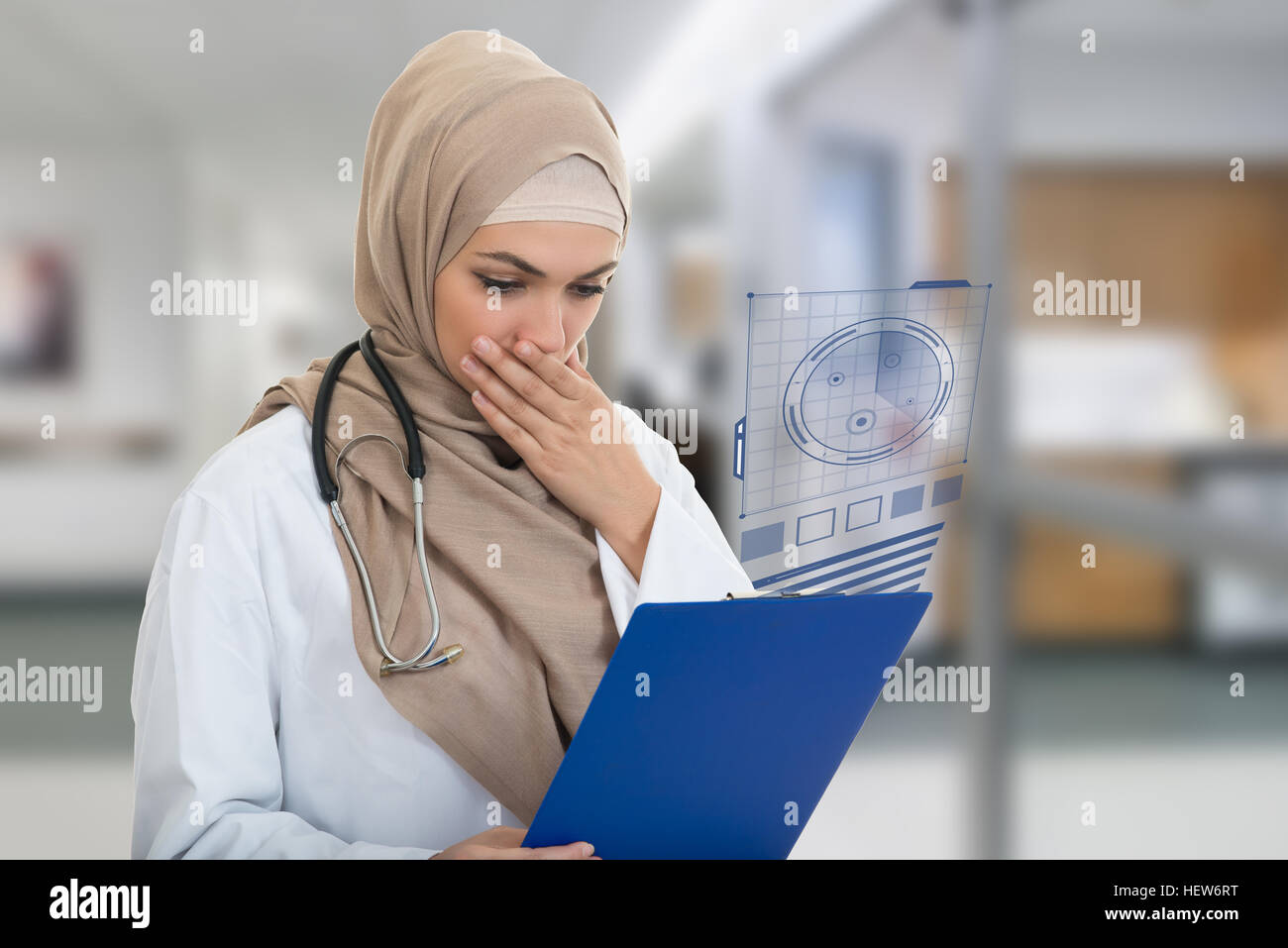 portrait of worried muslim female Medical doctor holding paperclip ...