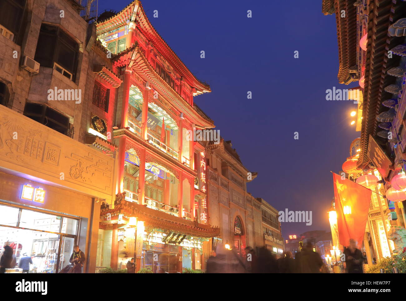People visit Beijing Hutong street in Beijing China. Hutongs are a type ...