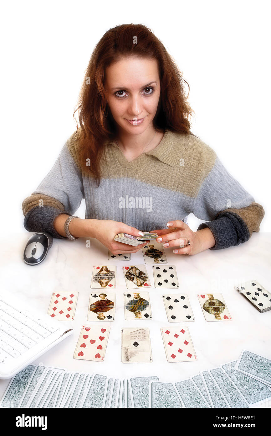 Fortune teller sitting in front of a computer with cards, symbol for ...