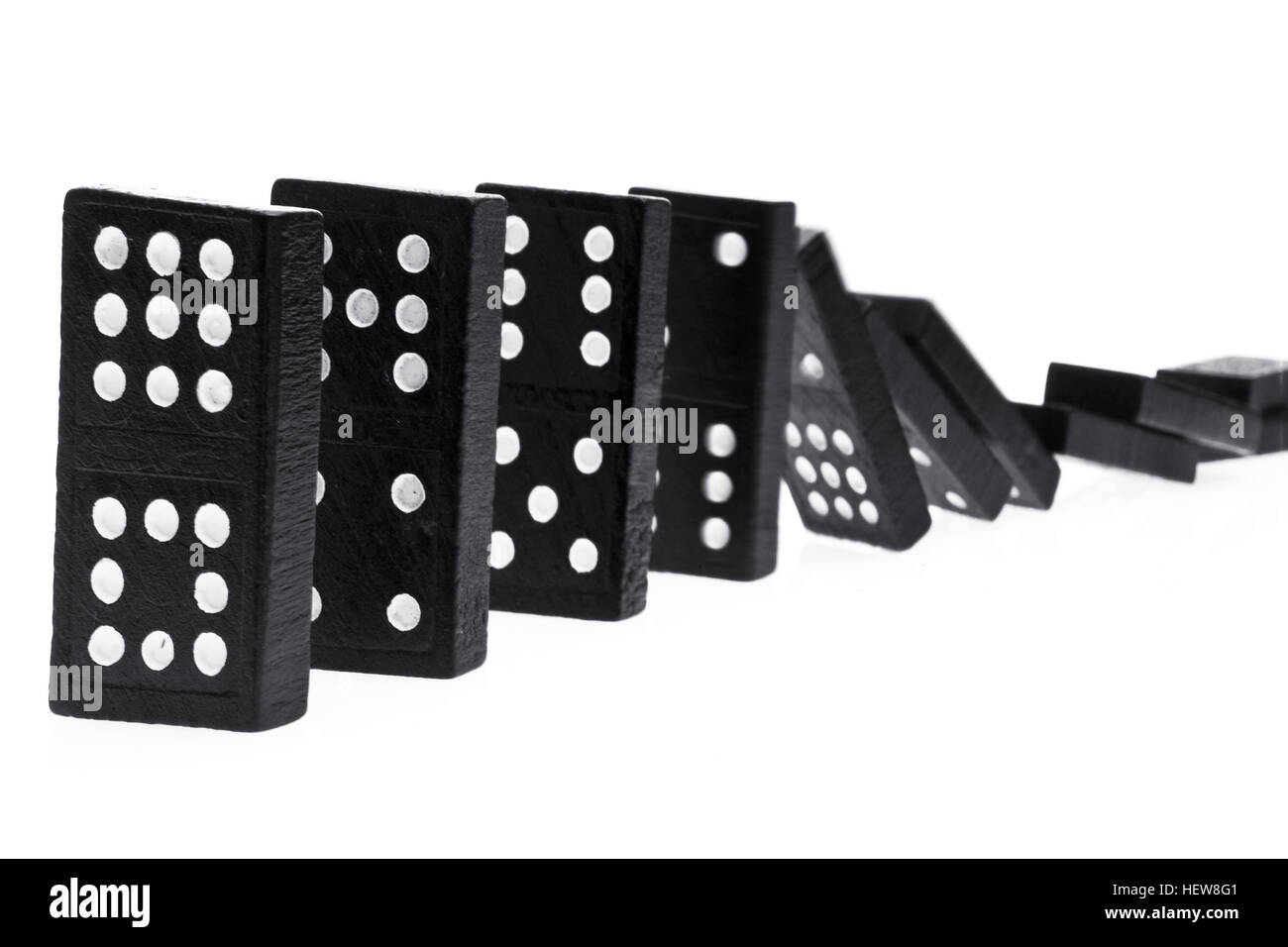 Dominoes falling over Stock Photo - Alamy