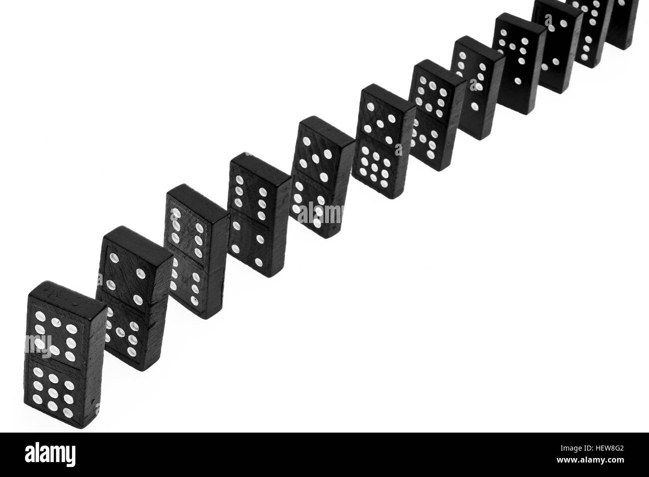 Dominoes in a row Stock Photo - Alamy