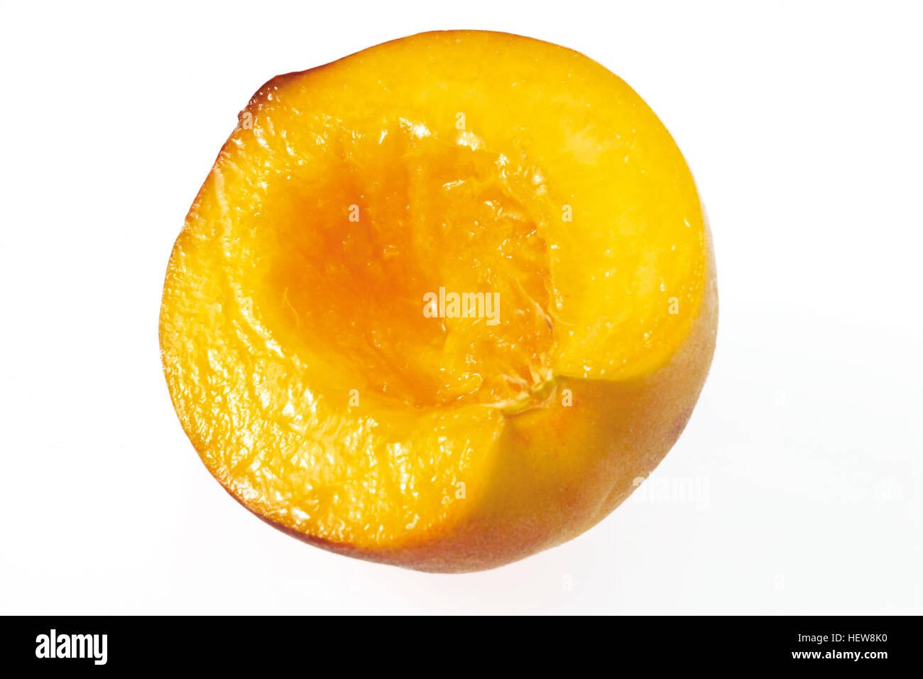 A half a yellow peach (Prunus persica), pitted Stock Photo - Alamy