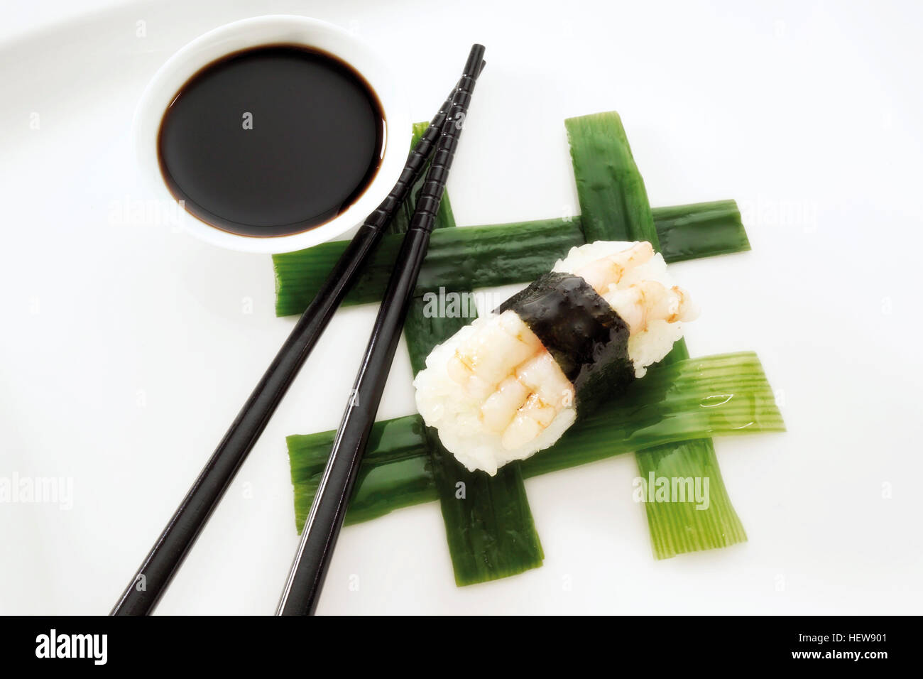 Sushi Nigiri, made with shrimp and rice wrapped in nori seaweed and ...