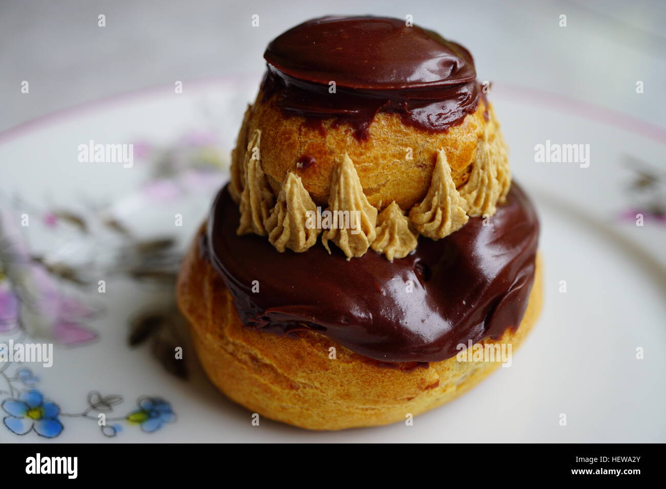A chocolate religieuse pastry in France Stock Photo - Alamy