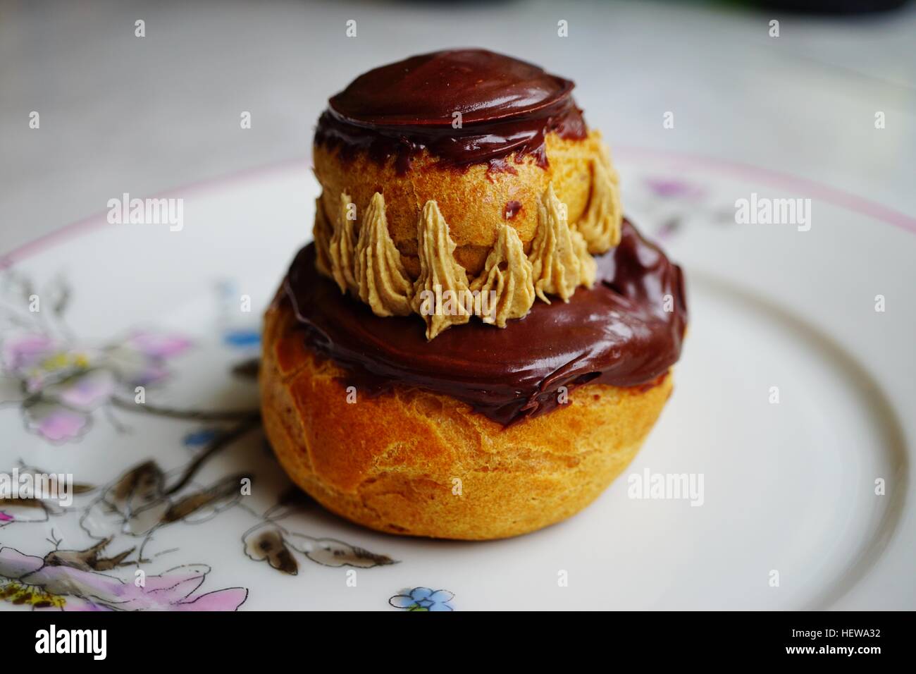 A chocolate religieuse pastry in France Stock Photo - Alamy