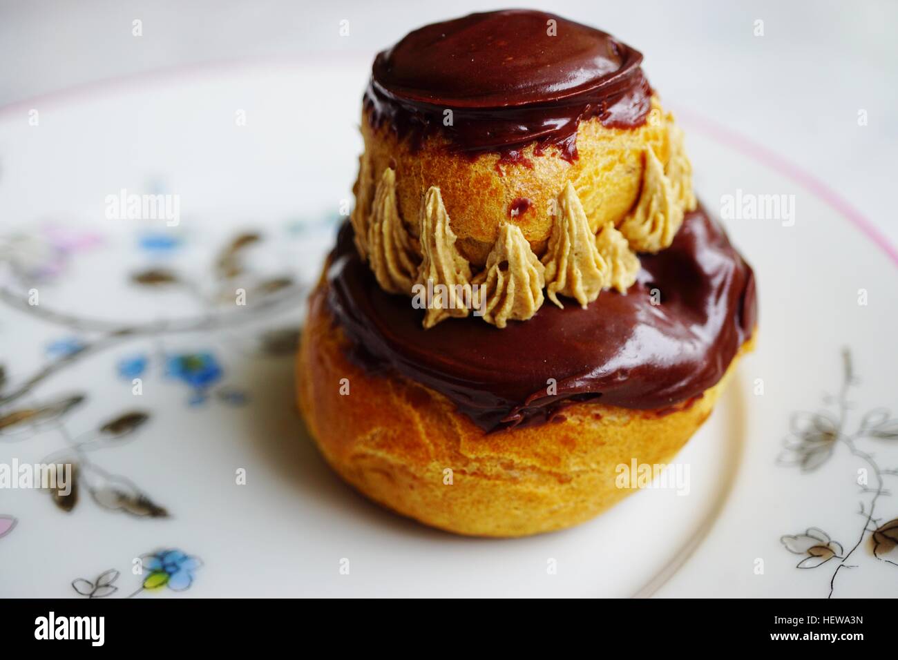 A chocolate religieuse pastry in France Stock Photo - Alamy