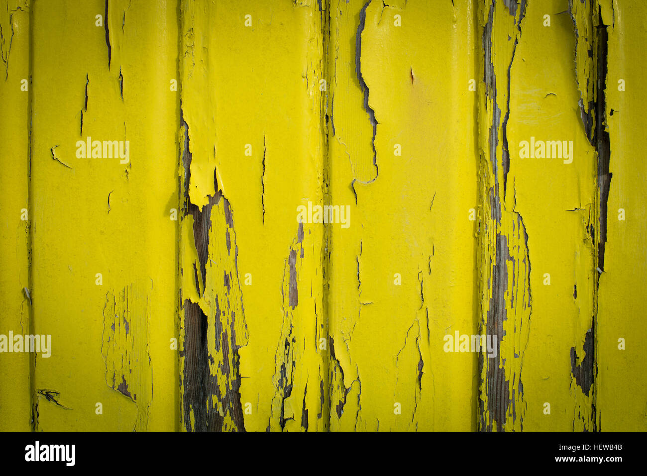 Flaking yellow paint on old beach huts at the beach Stock Photo - Alamy