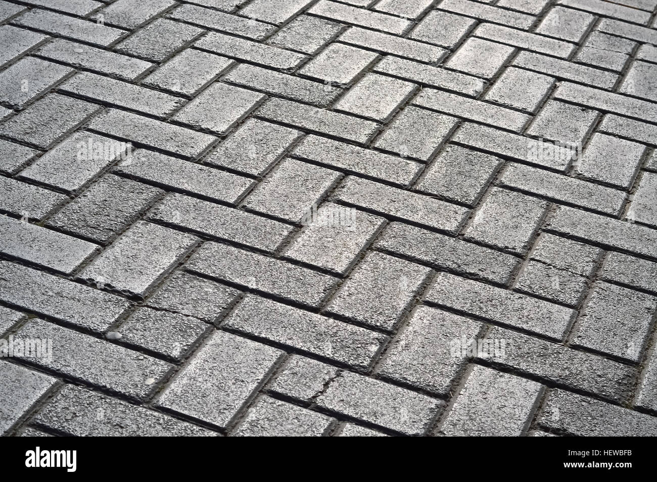 Closeup of paved sidewalk with grey stone bricks Stock Photo - Alamy