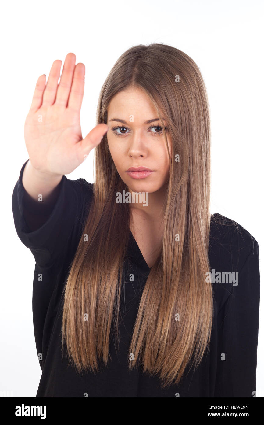 Pretty young girl making stop sign isolated on a white background Stock ...